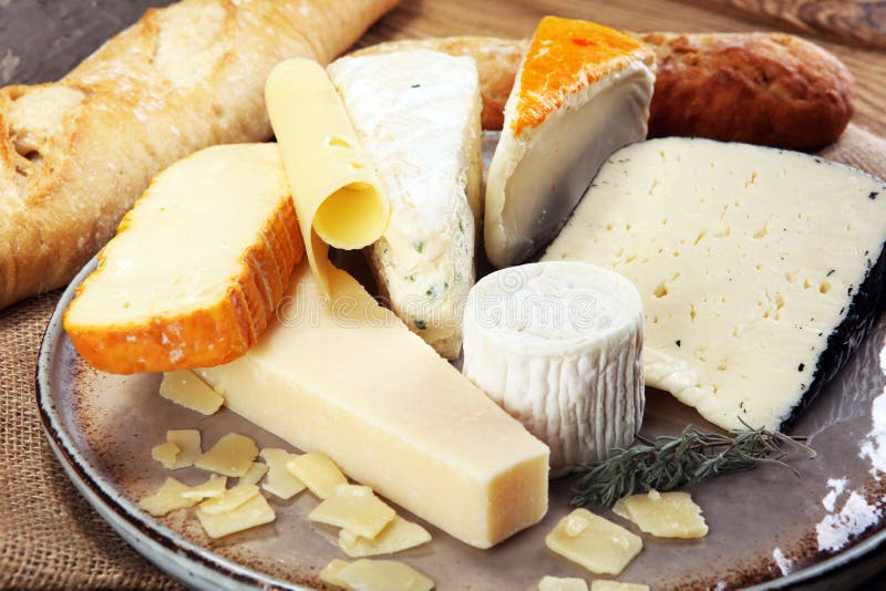 Cheese Platter with Different Cheese on Rustic Plate Stock Image ...