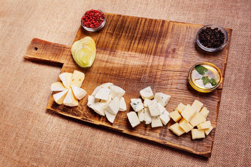 Cheese Platter Garnished on Rustic Wooden Board Stock Image - Image of ...