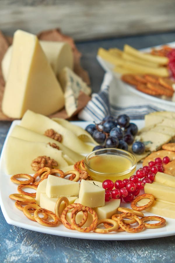Cheese Platter on a Wooden Board. Restaurant Menu Stock Photo - Image ...