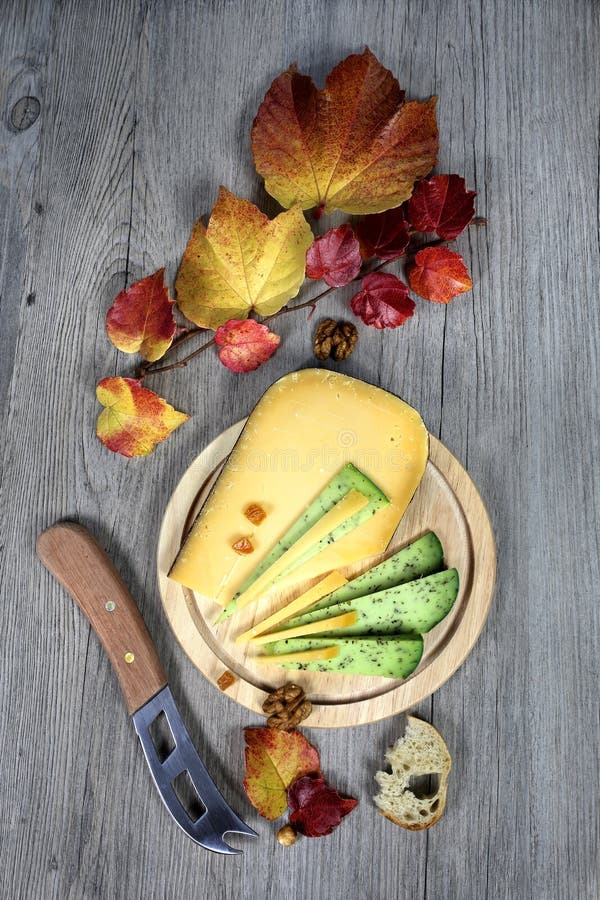 Cheese Platter: Solid Cheese and Autumn Leaves Stock Photo - Image of ...