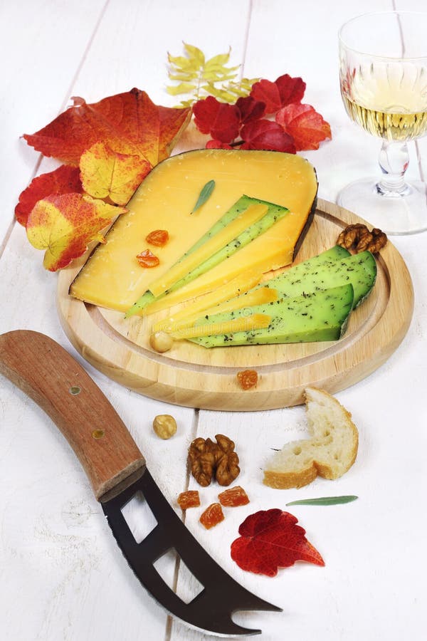 Cheese Platter: Solid Cheese, Autumn Leaves and Wineglass Stock Image ...