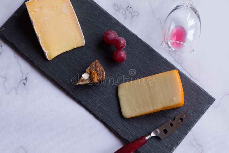 Cheese Platter Witch Assorted Cheese and Grapes Stock Image - Image of ...