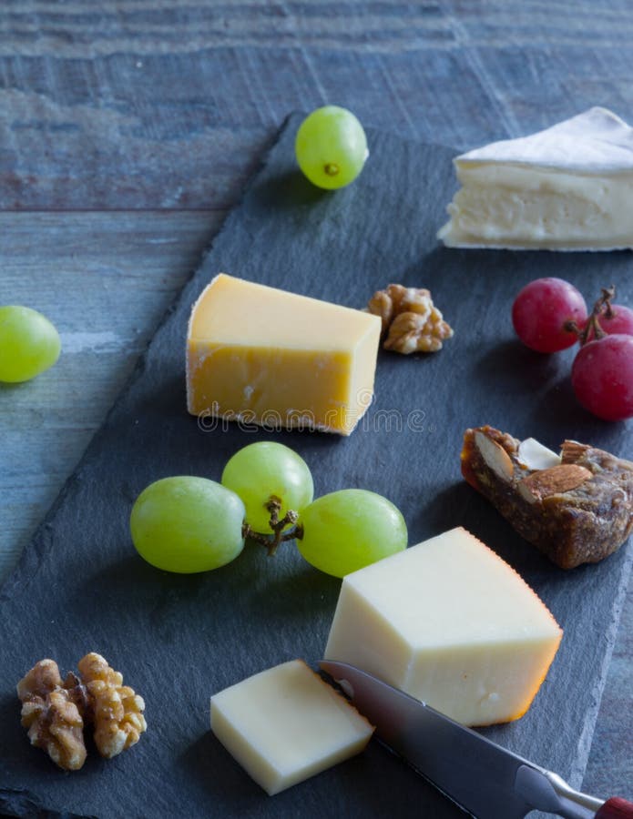 Cheese Platter Witch Assorted Cheese and Grapes Stock Photo - Image of ...