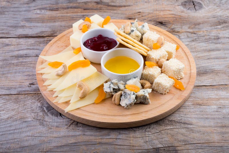 Cheese Platter on Wooden Board Stock Photo - Image of rustic, cuisine ...
