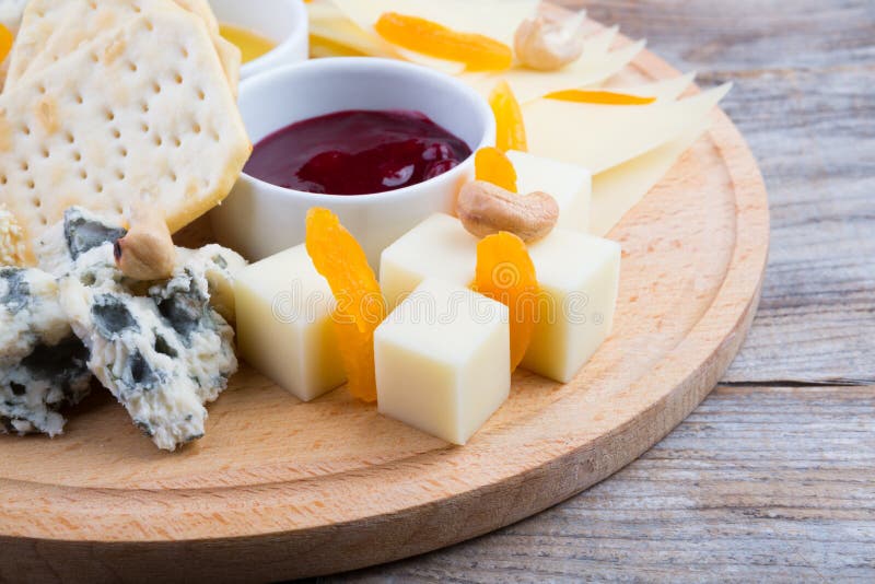 Cheese Platter on Wooden Board Stock Photo - Image of rustic, cuisine ...
