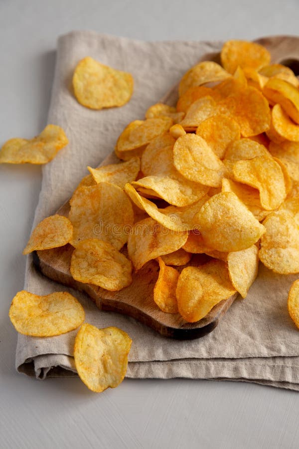 Cheese Potato Chips on a Wooden Board, Side View Stock Photo - Image of ...