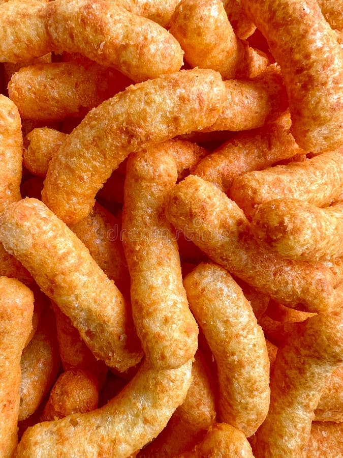 Cheese puffs stock photo. Image of closeup, crispy, vertical - 277474714