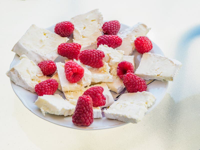 Cheese and raspberries stock photo. Image of ingredients - 121303140