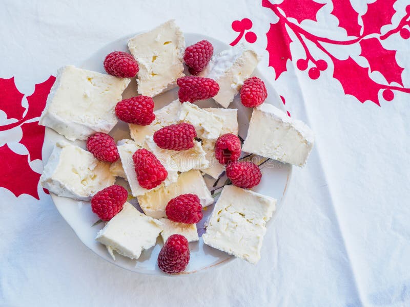 Cheese and raspberries stock photo. Image of cheese - 121303156