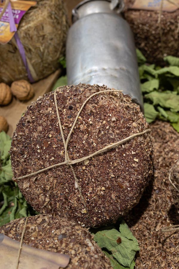 Cheese with Rind Covered with Hay on a Wooden Table Stock Image - Image ...