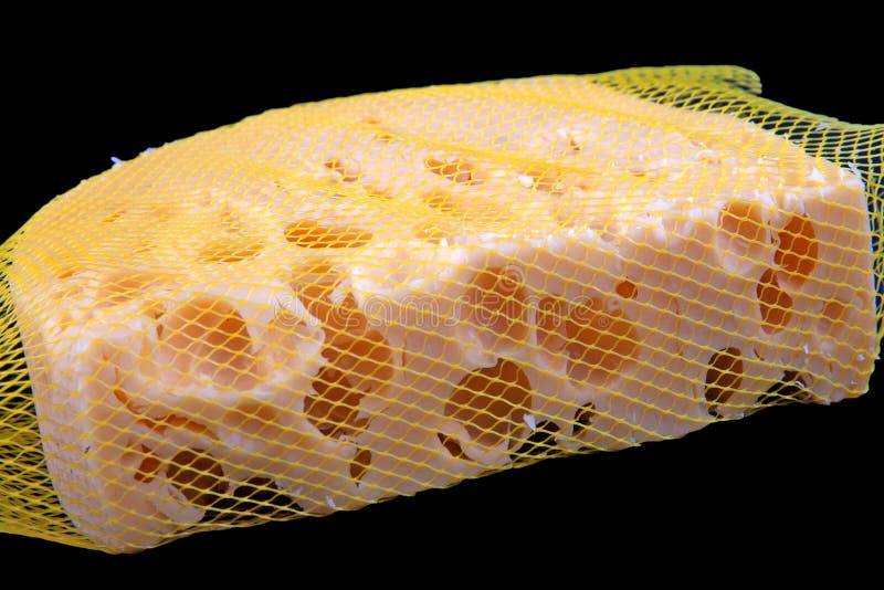 Cheese slice in net stock photo. Image of color, background - 13732028