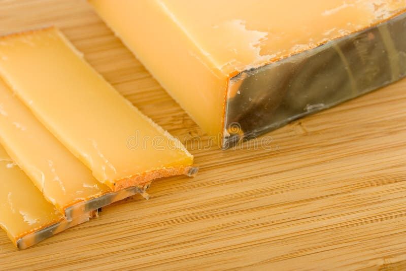 Cheese, Sliced on the Board Stock Photo - Image of gourmet, delicacy ...