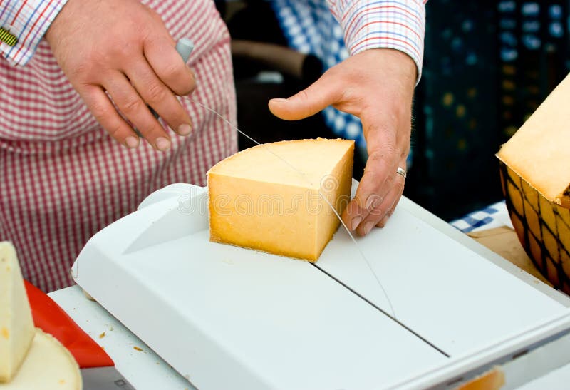 Cheese Slicing. stock photo. Image of delicatessen, male - 20018118
