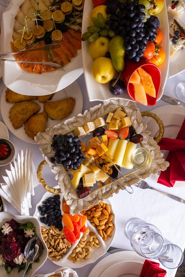 Cheese Slicing on the Table and Various Snacks on the Table Top View ...