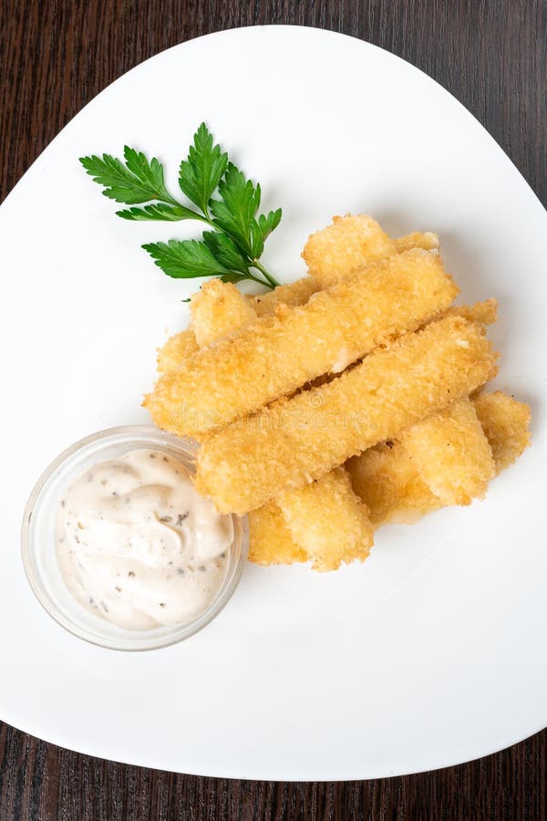 Cheese Sticks Breaded, with Sauce and Herbs, on a Platter Stock Image ...
