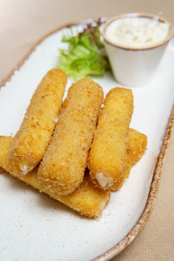 Cheese Sticks Fried in Breadcrumbs. Mozzarella Cheese Sticks on a Plate ...