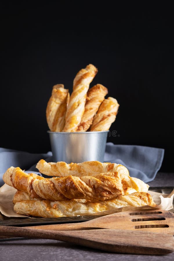 Cheese Sticks Made of Puff Pastry on a Dark Background Stock Image ...