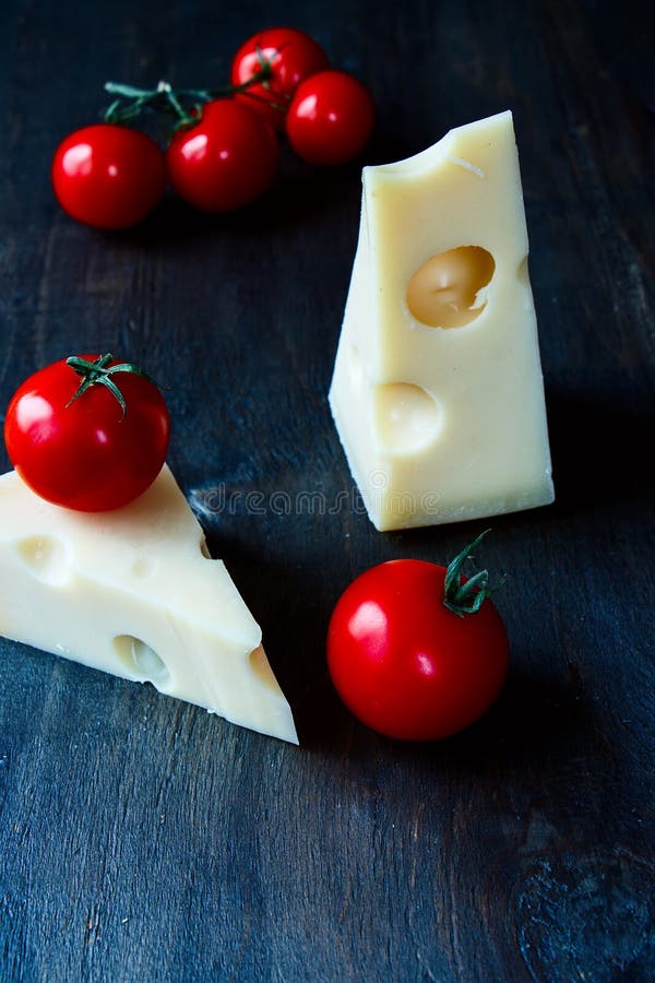 Cheese and tomatoes stock image. Image of dairy, hole - 54566223