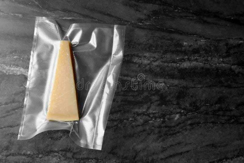 Cheese in Vacuum Pack on Black Marble Table, Top View. Space for Text ...