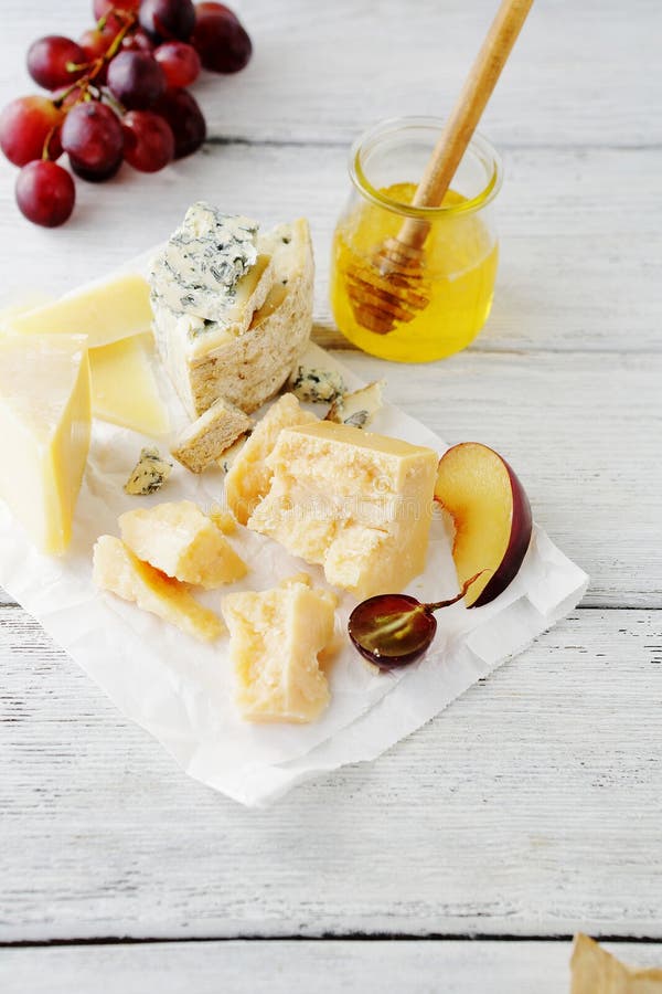 Cheese Variations and Honey Stock Image - Image of cheeses, board: 62181571