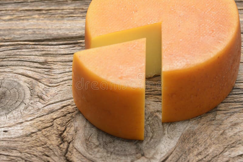 Cheese Wheel on Wooden Table. Stock Image - Image of farm, feed: 85118245