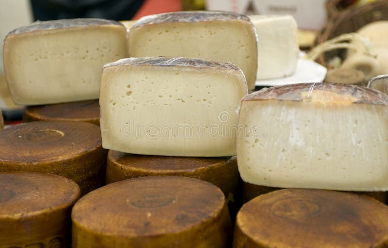 Cheese wheels cut stock image. Image of orange, lunch - 1276641