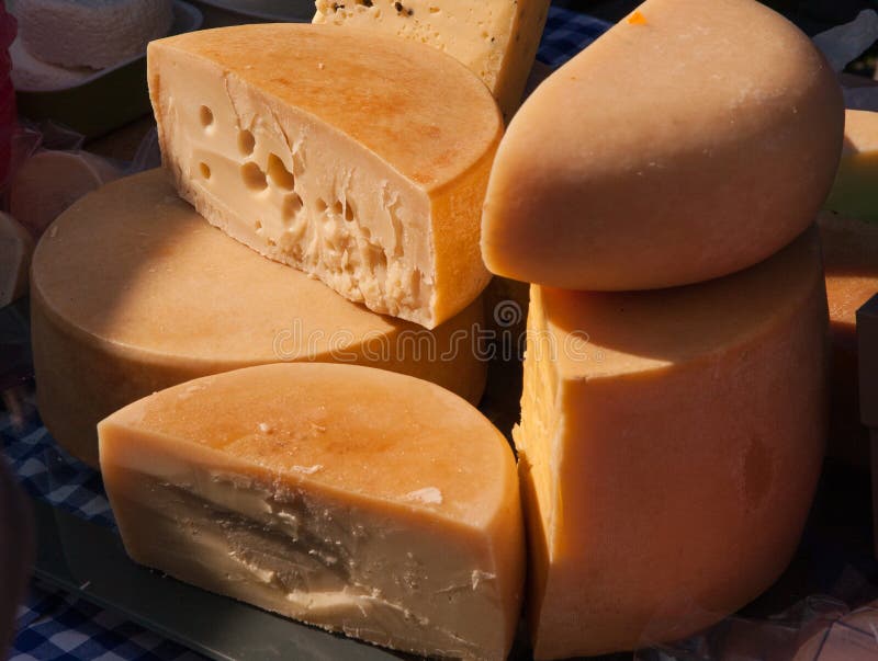 Cheese Wheels on Display at the Farmers Market Stock Photo - Image of ...