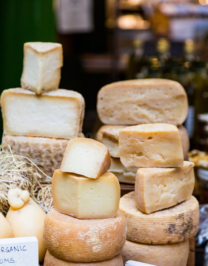 Cheese Wheels in Market stock photo. Image of italy, italian - 93935384