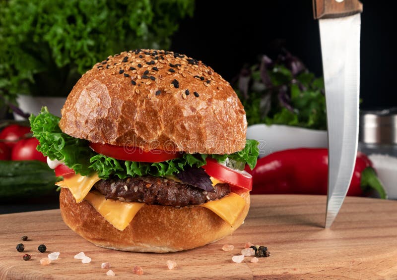 Cheeseburger - American Burger with Fresh Vegetables on Wooden Board ...