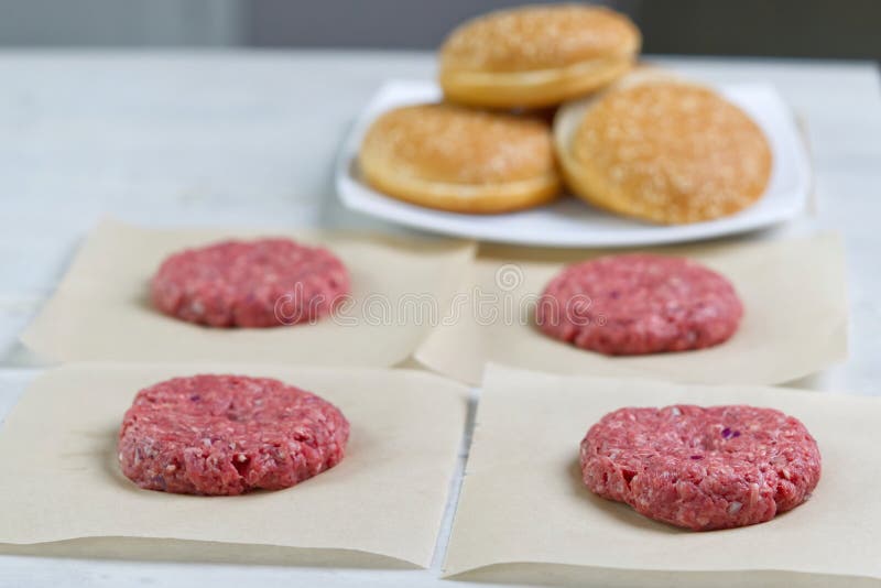 Cheeseburger and Beefburger Ingredients. Bun and Raw Burger Cutlets ...