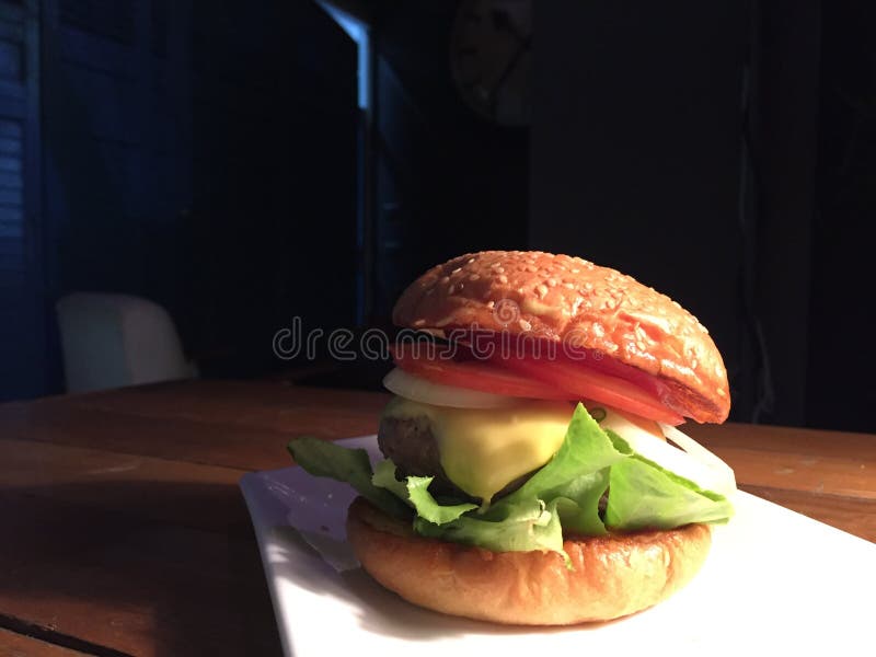 Cheeseburger stock image. Image of table, shadow, light - 167052447