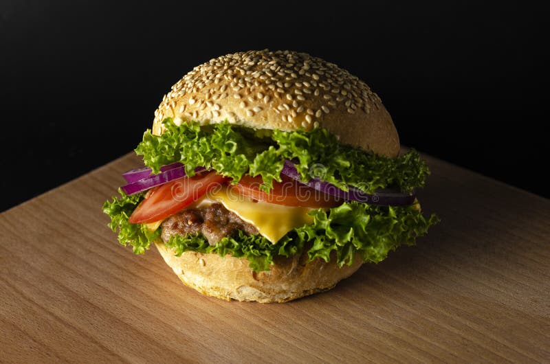 Cheeseburger while Cooking at Home Stock Image - Image of hearty ...