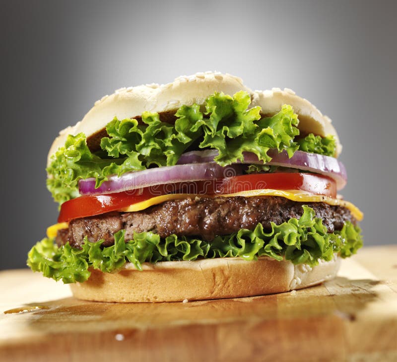 Cheeseburger with Lettuce Tomato and Onion. Stock Photo - Image of ...