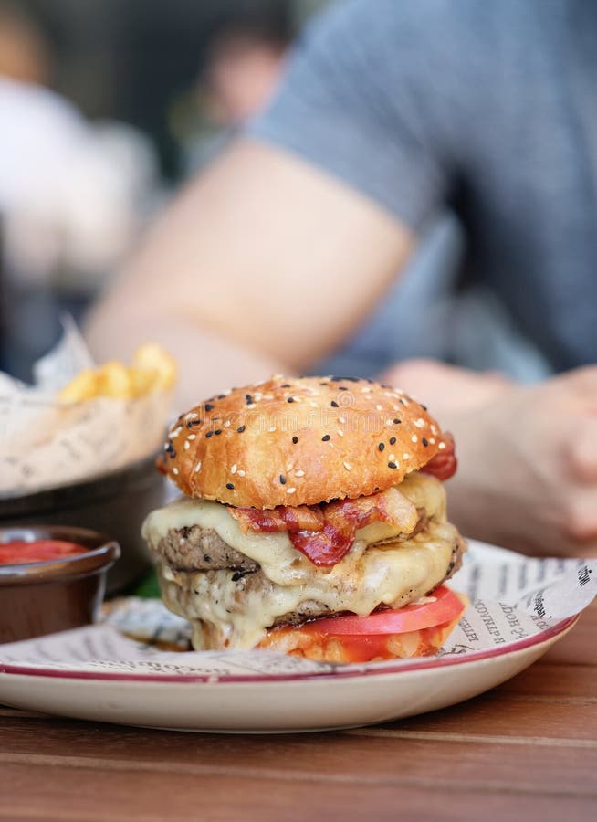 Cheeseburger in Outdoor Restaurant Stock Image - Image of male, dinner ...