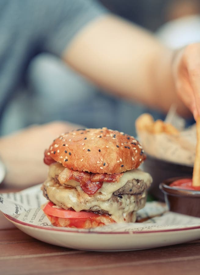 Cheeseburger in Outdoor Restaurant Stock Image - Image of double, adult ...