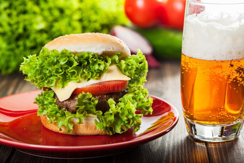 Cheeseburger on a Plate with Beer Stock Image - Image of cheese, meal ...