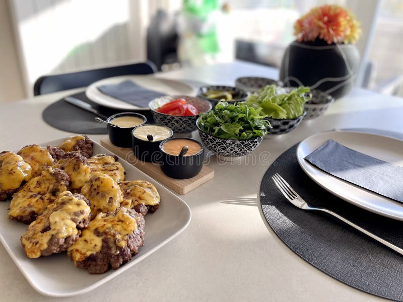Cheeseburger Served on the Dining Table Stock Photo - Image of bowl ...