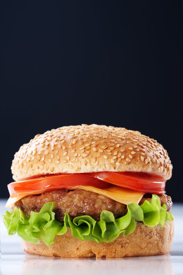 Cheeseburger with Tomatoes and Lettuce Stock Image - Image of fast ...