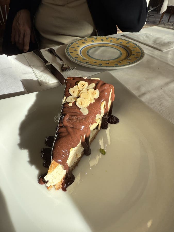 Cheesecake with Chocolate Sauce Served at Italian Restaurant Stock ...