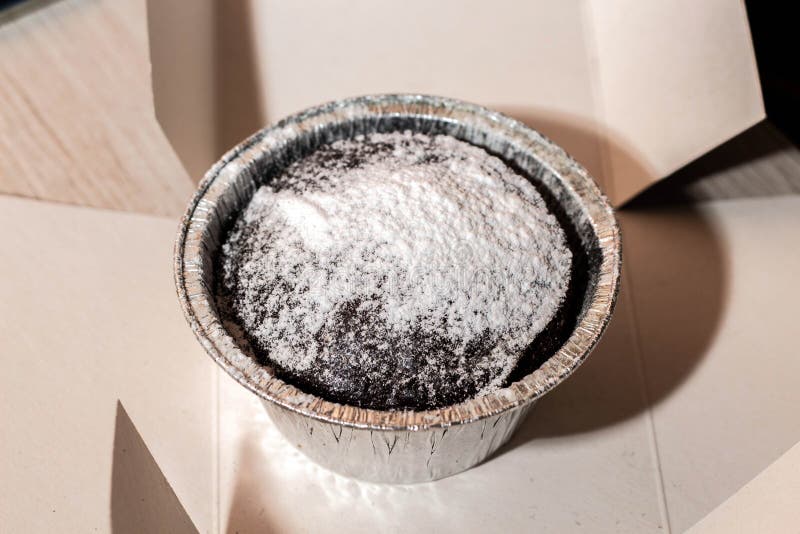 Cheesecake with Icing Sugar on Top in a Foil Container. Cake on Top ...