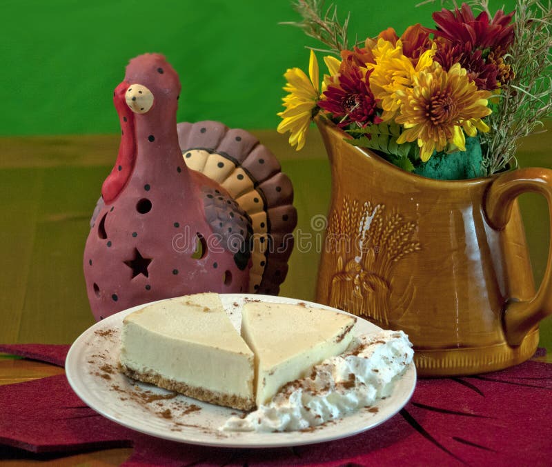 Cheesecake on Thanksgiving Table with Ceramic Turkey Decoration Stock ...