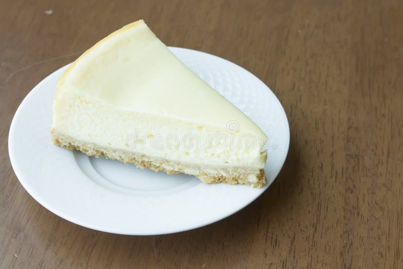 Cheesecake on wood table stock photo. Image of dessert - 139041508