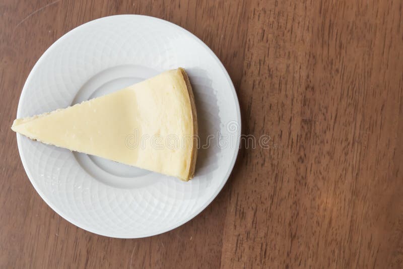 Cheesecake on wood table stock photo. Image of sweet - 139041544