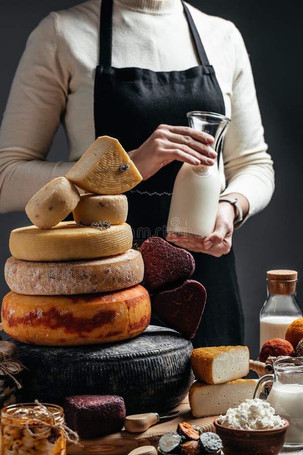 Cheesemaker is Controlling the Seasoning Lots of Wheels of Cheese ...