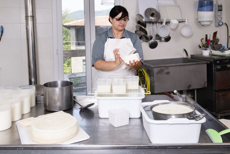 Cheesemaker Turns the Shapes of Fresh Cheese Stock Photo - Image of ...
