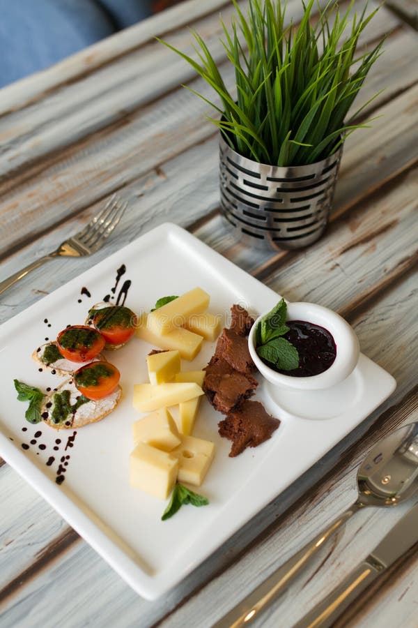 Cheeseplate with Souce on a Table Stock Image - Image of plate ...