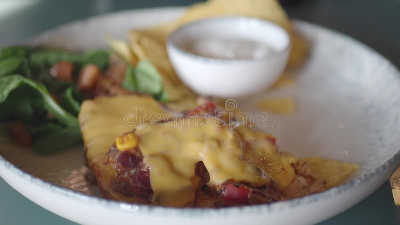 Cheesy Chicken Dish with Chips and Salad Stock Video - Video of plate ...