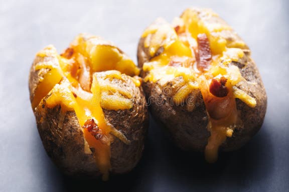 Cheesy jacket potato stock image. Image of closeup, english - 245561005