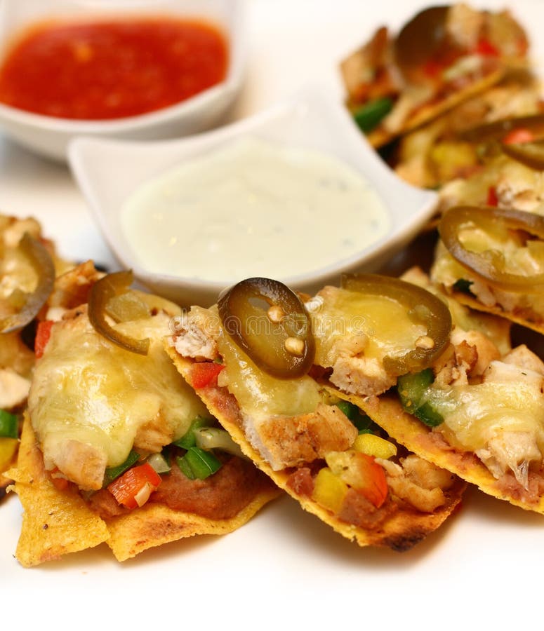Cheesy Nachos with Sliced Vegetable Stock Photo - Image of sauce, plate ...