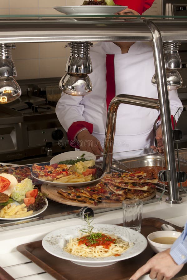 Chef Standing Behind Full Lunch Service Station Stock Photo - Image of ...